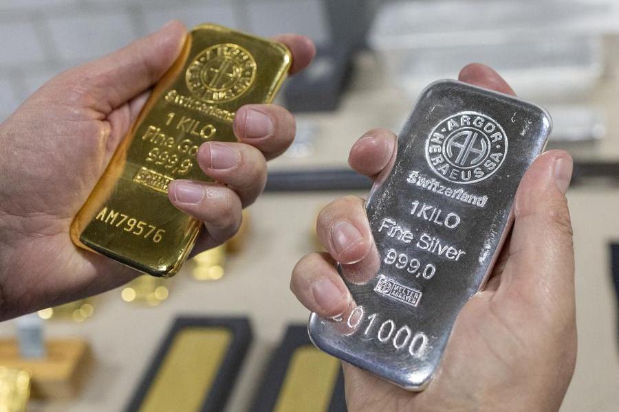 Gold, silver rise to near record highs on lingering safe-haven demand