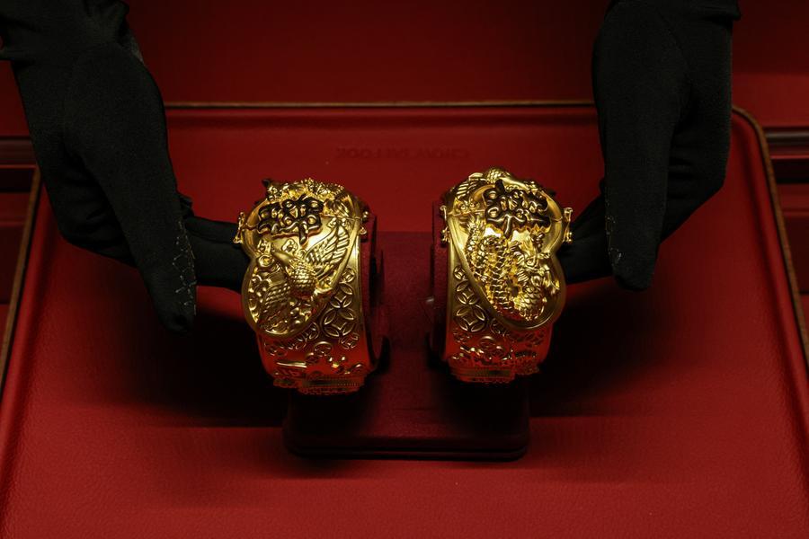 Gold climbs as lower oil eases inflation, rate-hike fears