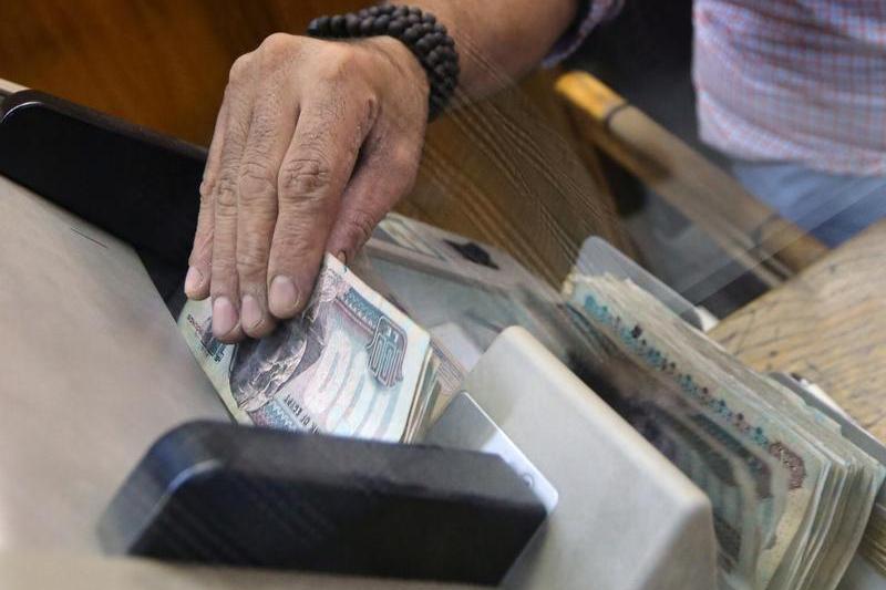 Banks in Egypt set withdrawal limits on using ATM cards abroad to ease ...