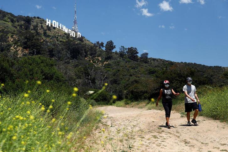 Hollywood’s iconic sign gets big paint job before its 100th anniversary