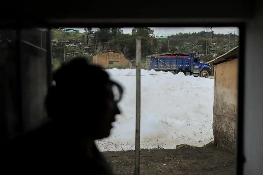 Residents flee foam spewing from polluted river in Colombia