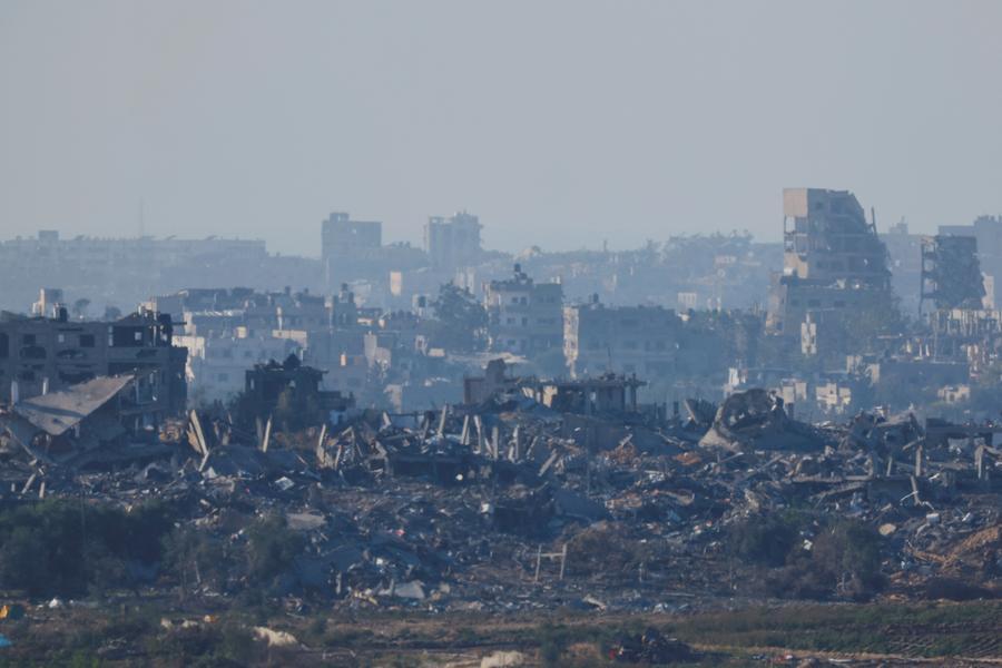 In Gaza, rows of white shrouds symbolise mounting civilian deaths