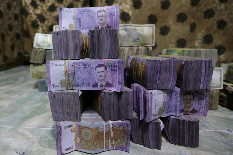 Syria to revalue currency, dropping two zeros in bid for stability ...