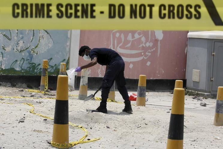 UPDATE 3-Bomb kills two policemen in worst Bahrain bombing in months