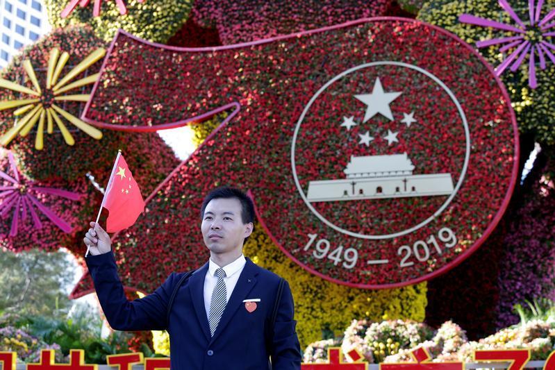 China turns 70, to forced applause